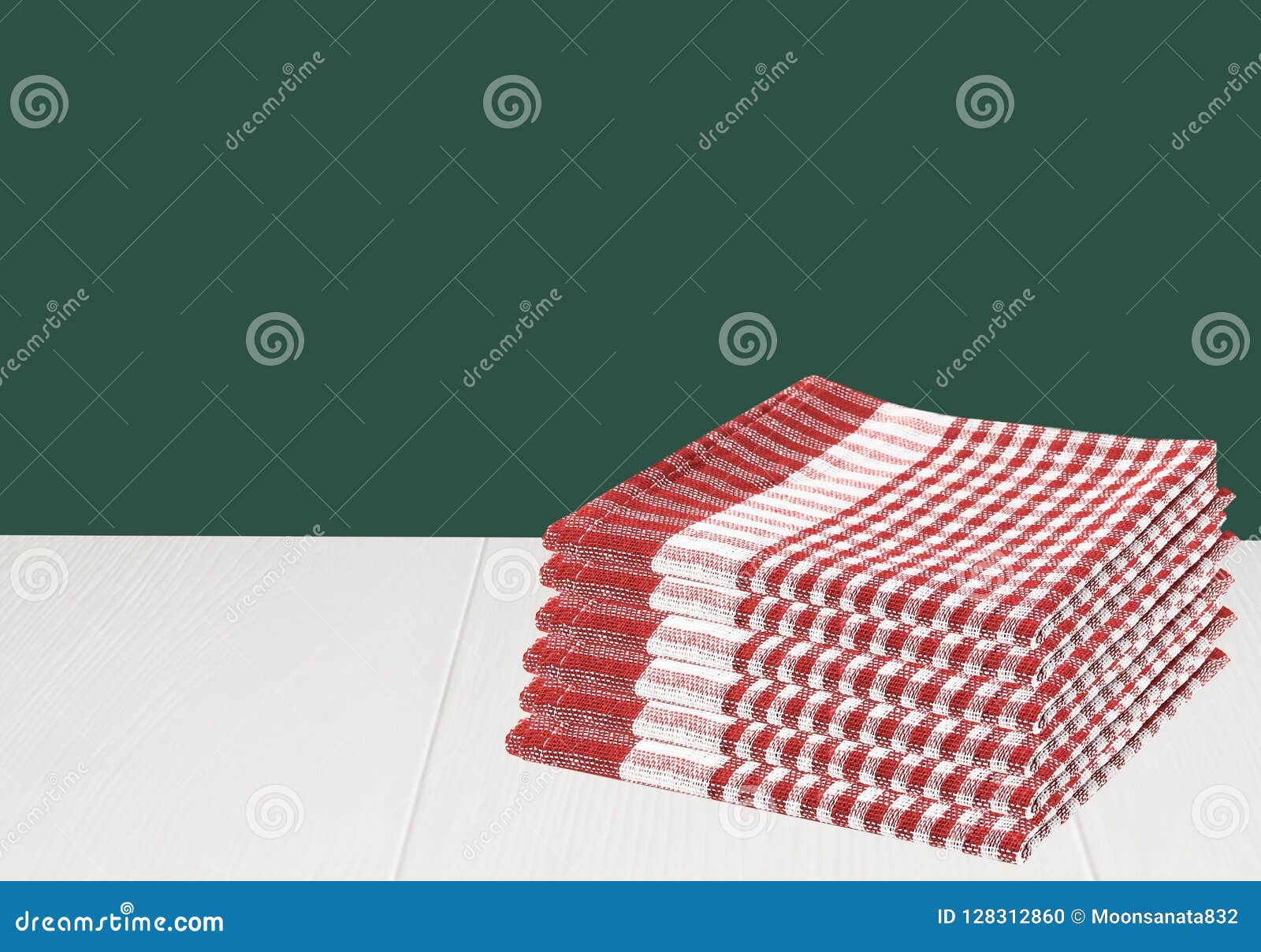 Stack of Cotton Kitchen Napkin on White Table Over Dark Green ...