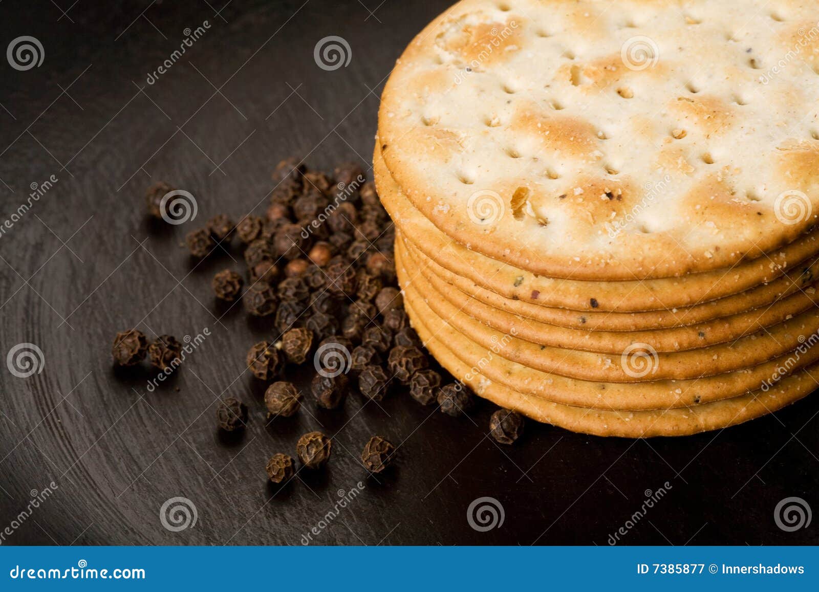 Stack of crackers stock image. Image of black, stack, seasoning - 7385877