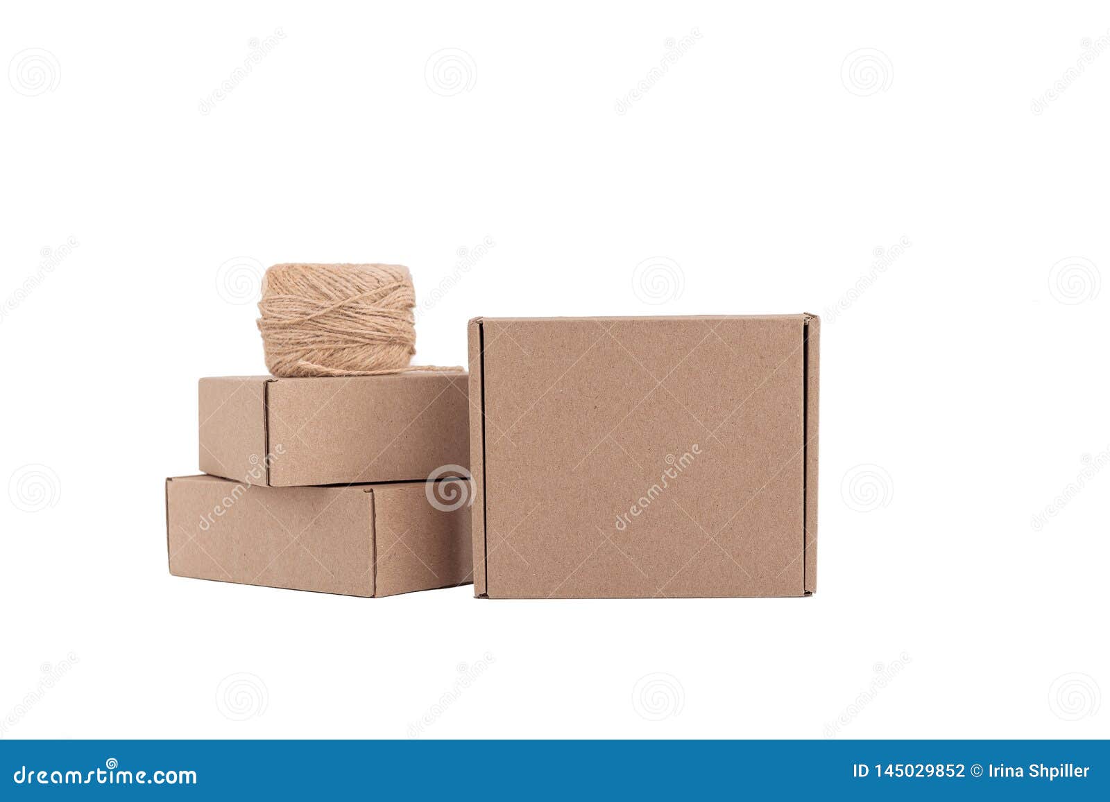 Stack of Craft Paper Boxes and Coil of Rope Isolated on White Stock ...