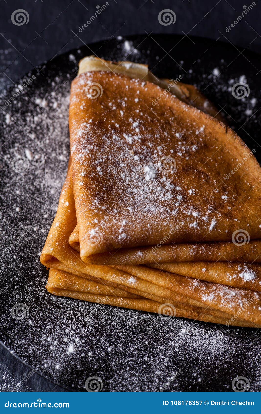 Stack of Crepes with Powdered Sugar on Dark Background. Stock Image ...