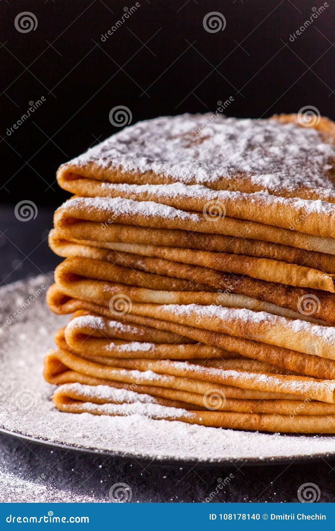 Stack of Crepes with Powdered Sugar on Dark Background. Stock Photo ...