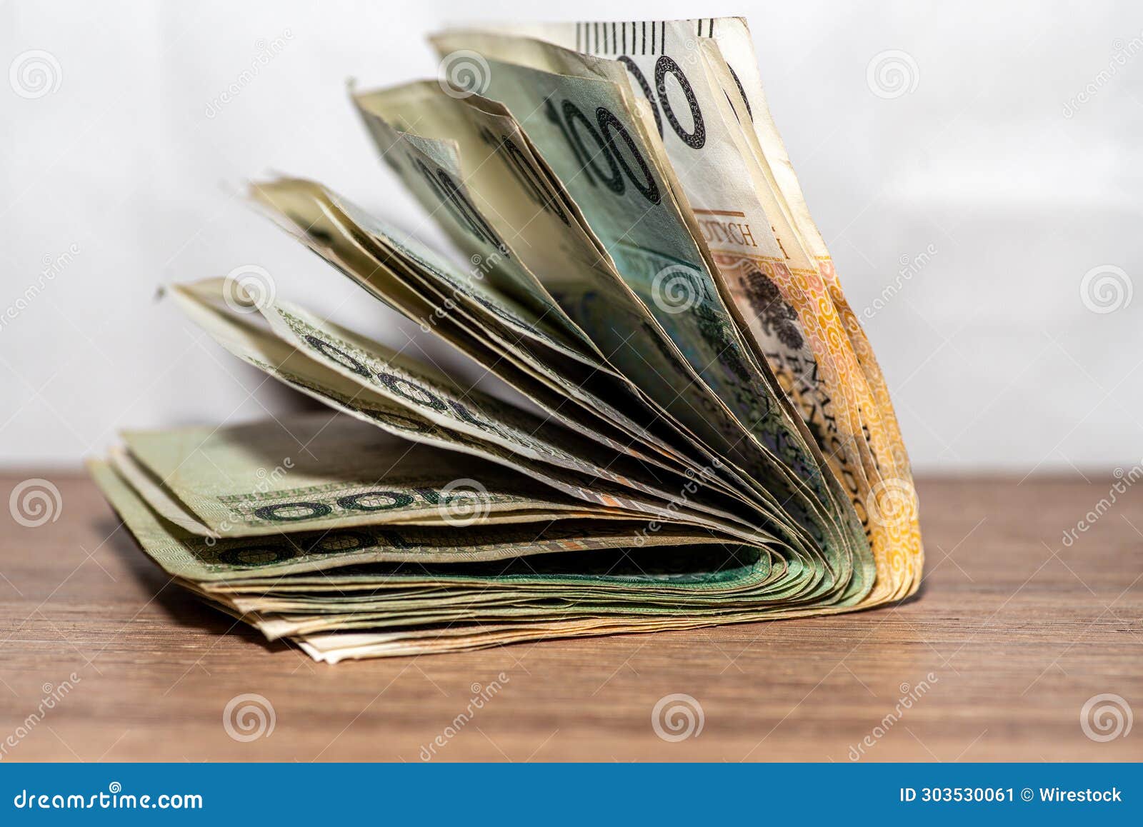 Stack of Currency Bills Held Together by an Elastic Band Takes the ...