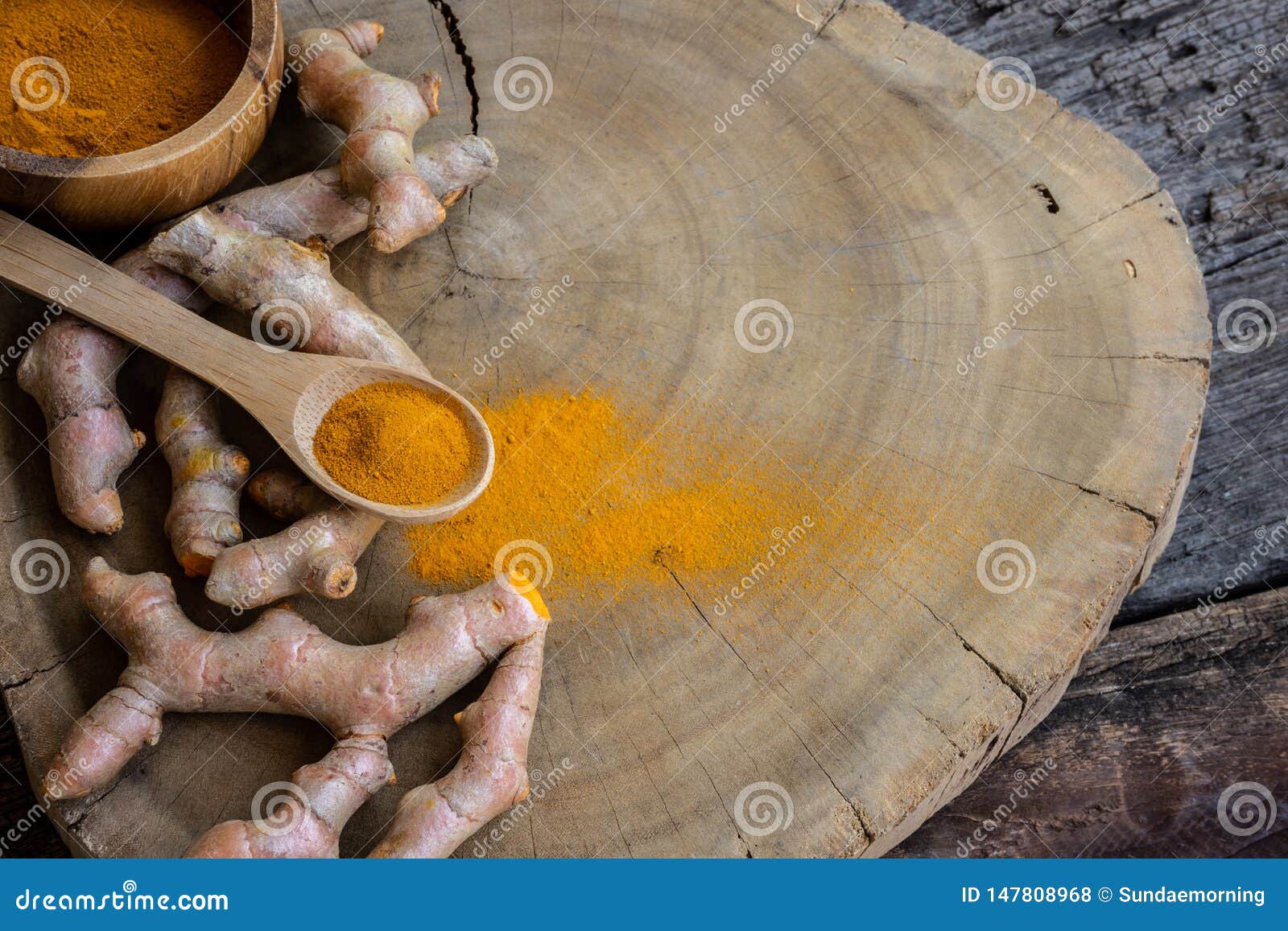 Stack of Cut Fresh Turmeric on Wood Background, Herb Concept ...