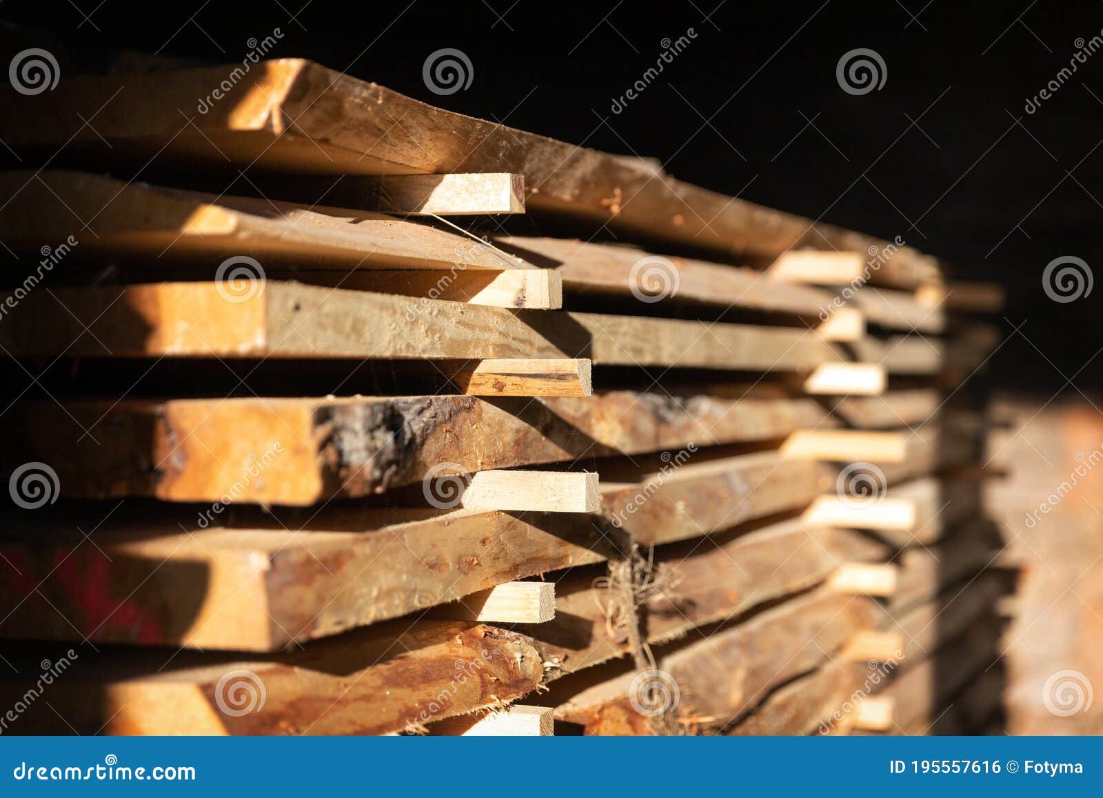 Stack of cut wooden boards stock photo. Image of lumber - 195557616