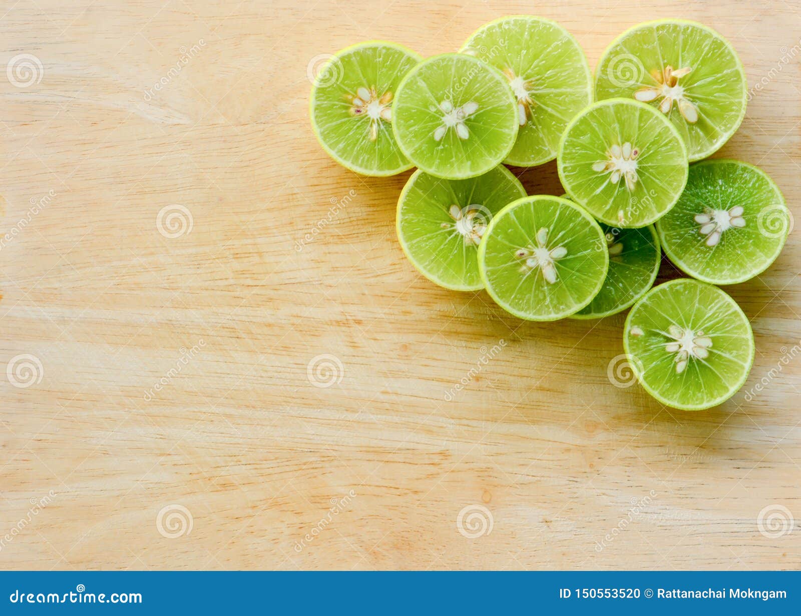 Stack of Cutting Fresh Lemon Lime Fruits on Wooden Chopping Board ...