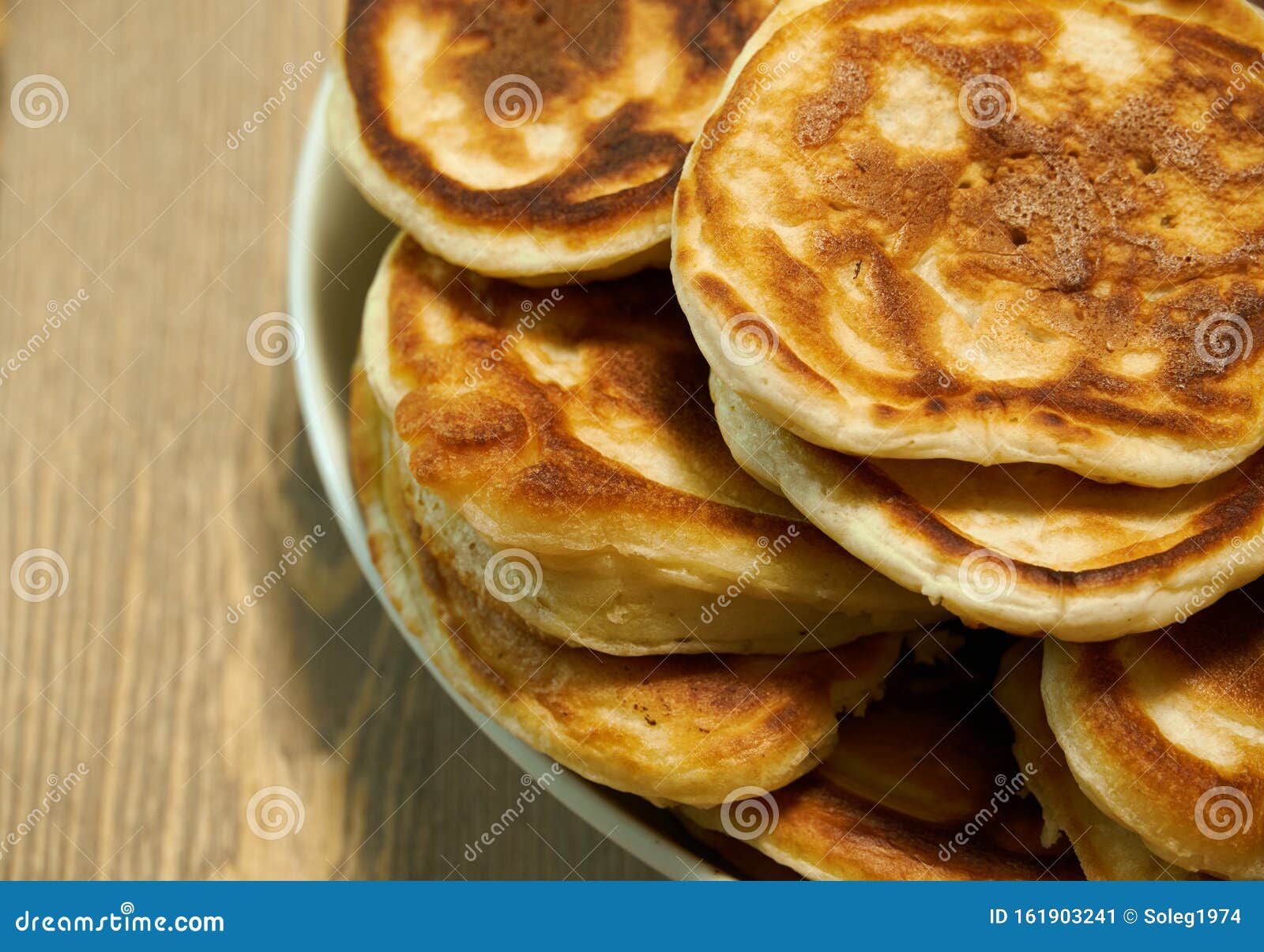 Stack of Delicious Homemade Pancakes on Plate, Wooden Table As ...