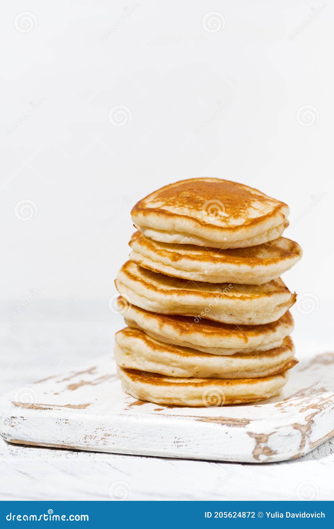 Stack of Delicious Pancakes on a White Background, Vertical Stock Photo ...