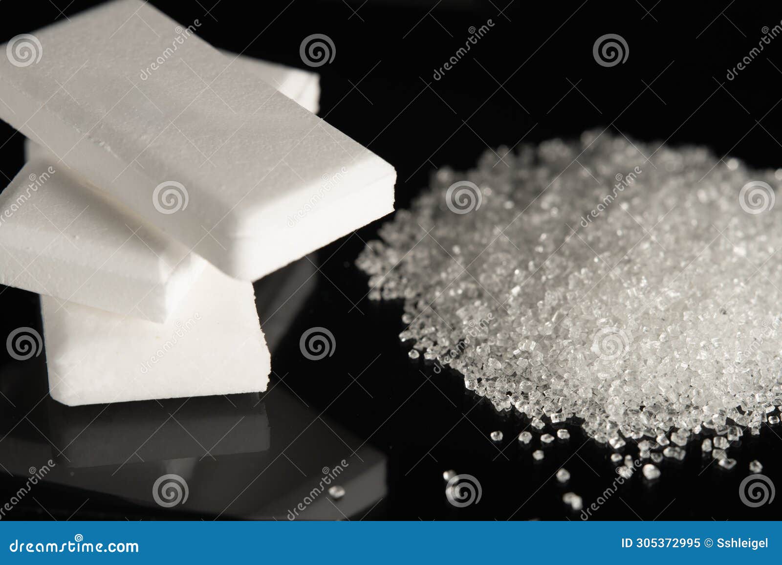 A Stack of Dextrose Glucose Tablets and a Pile of White Granulated ...