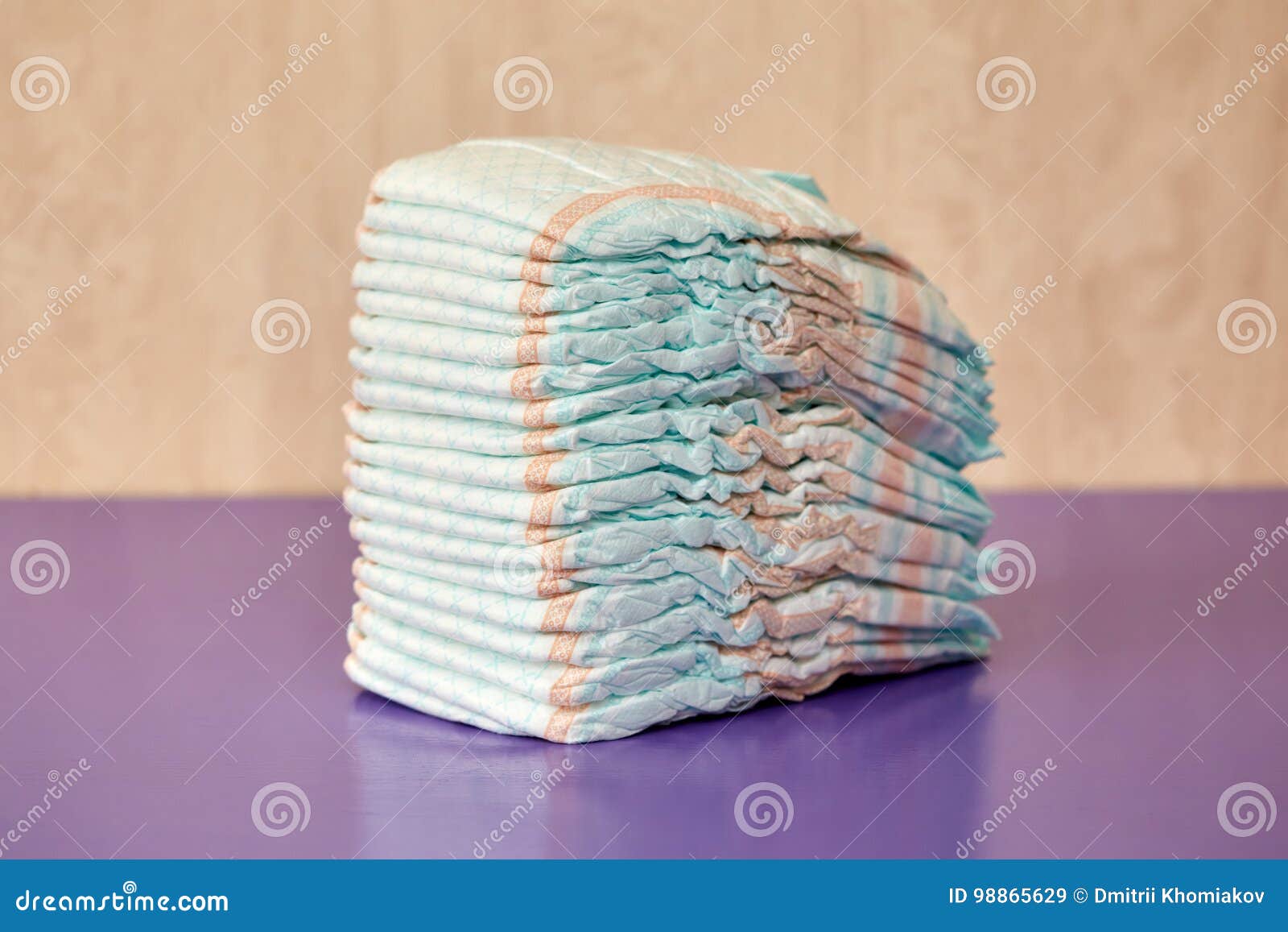 Stack of Diapers or Nappies on Purple Background Stock Image - Image of ...