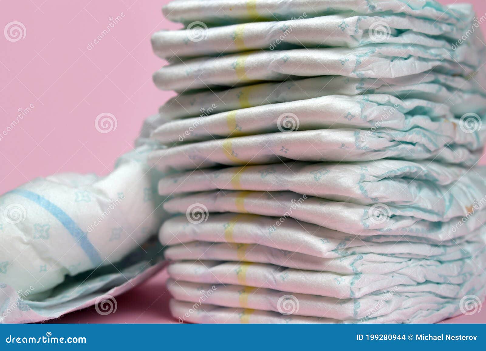 Stack of Diapers on a Pink Background, Baby Hygiene Products Stock ...