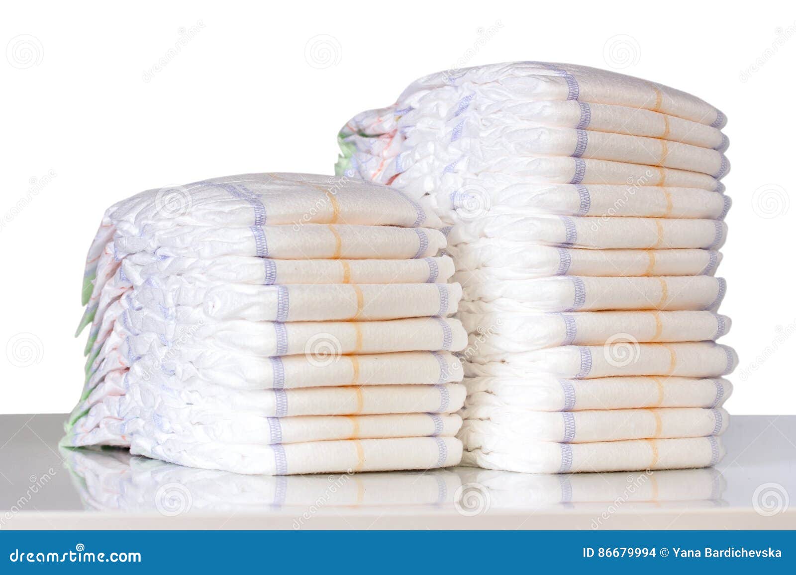 Stack of Diapers on Table Isolated on White. Stock Photo - Image of ...