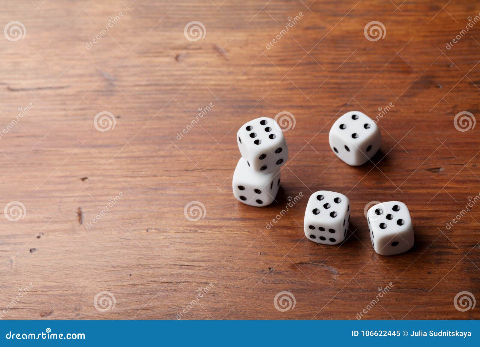 Stack of Dice on Rustic Wooden Table. Gambling Devices. Game of Chance ...