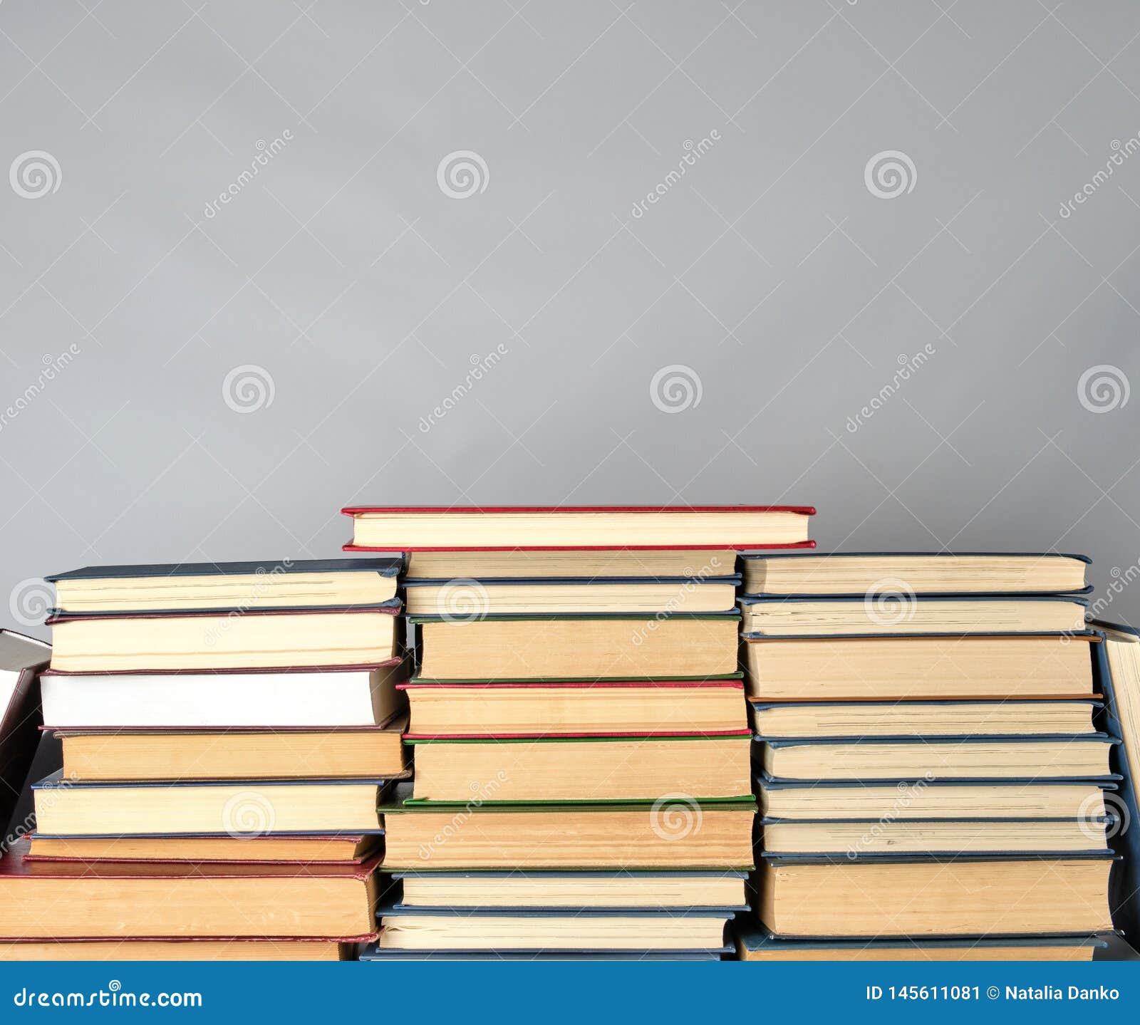 Stack of Different Books on a Gray Background Stock Image - Image of ...