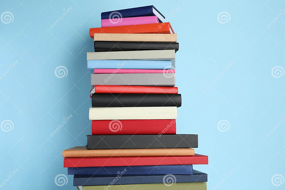 Stack of Different Books on Light Blue Background Stock Photo - Image ...