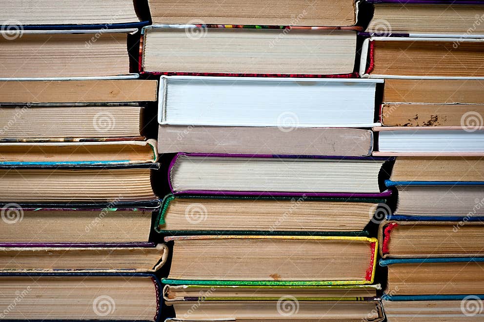 A Stack of Different Books of New and Old Folded Vertically Stock Photo ...