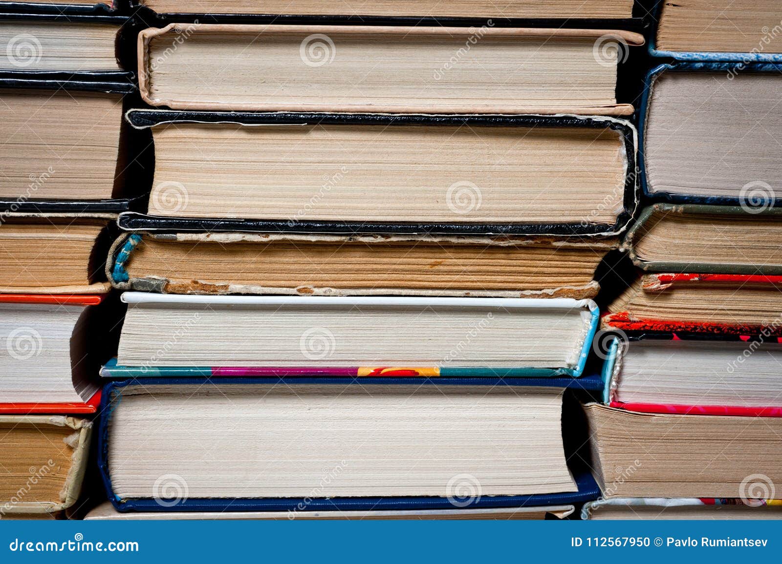 A Stack of Different Books of New and Old Folded Vertically Stock Photo ...