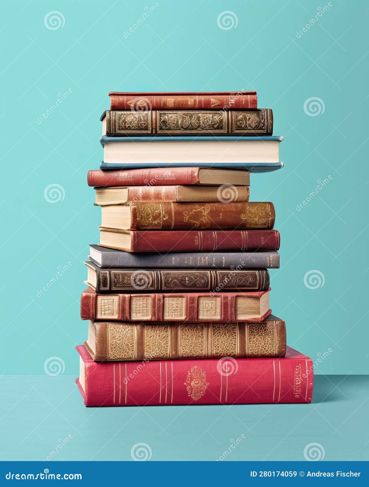 A Stack of Different Books by Size and Color on a Blue Background ...
