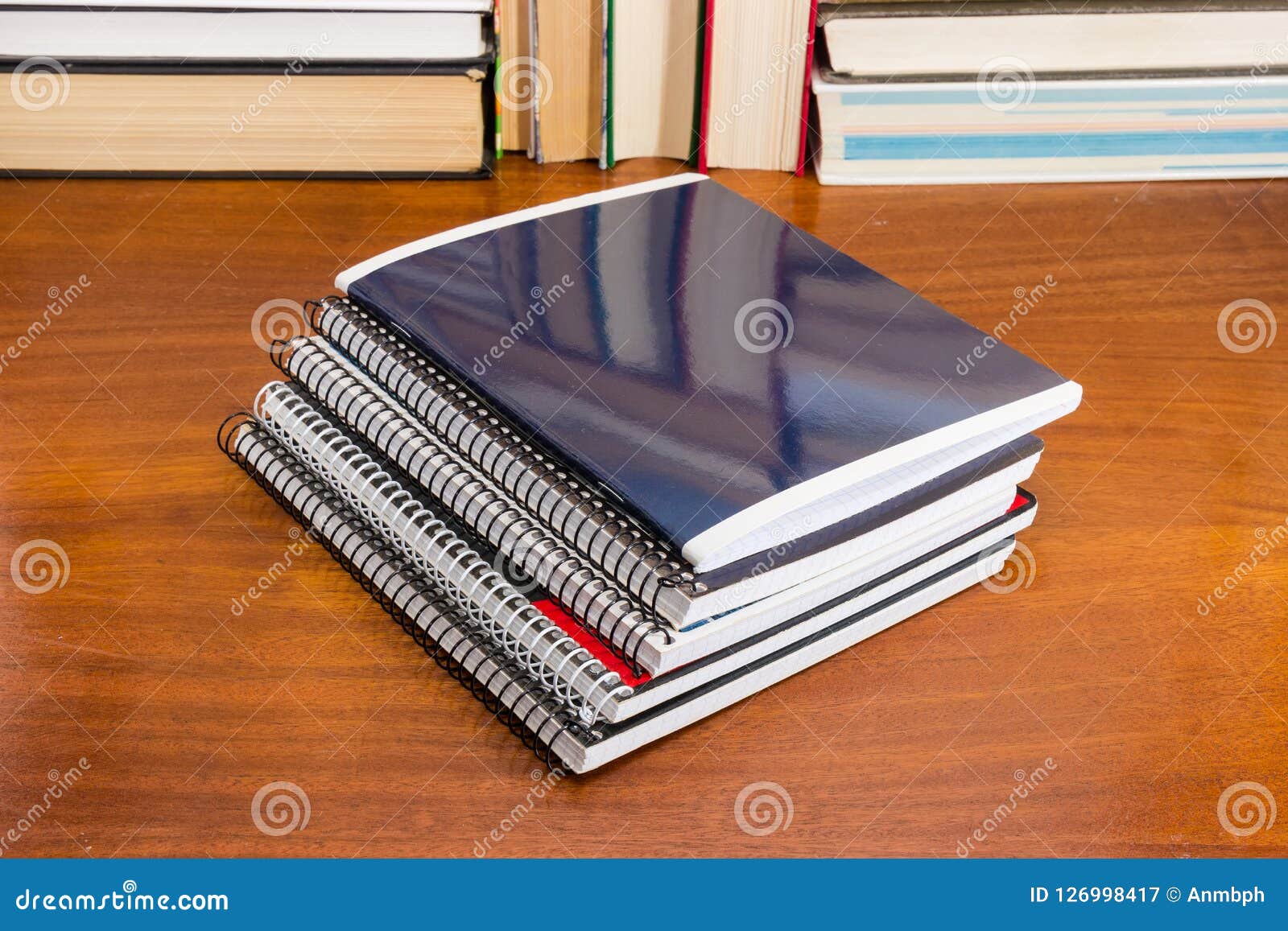 Stack of Different Exercise Books on Table Against of Books Stock Image ...