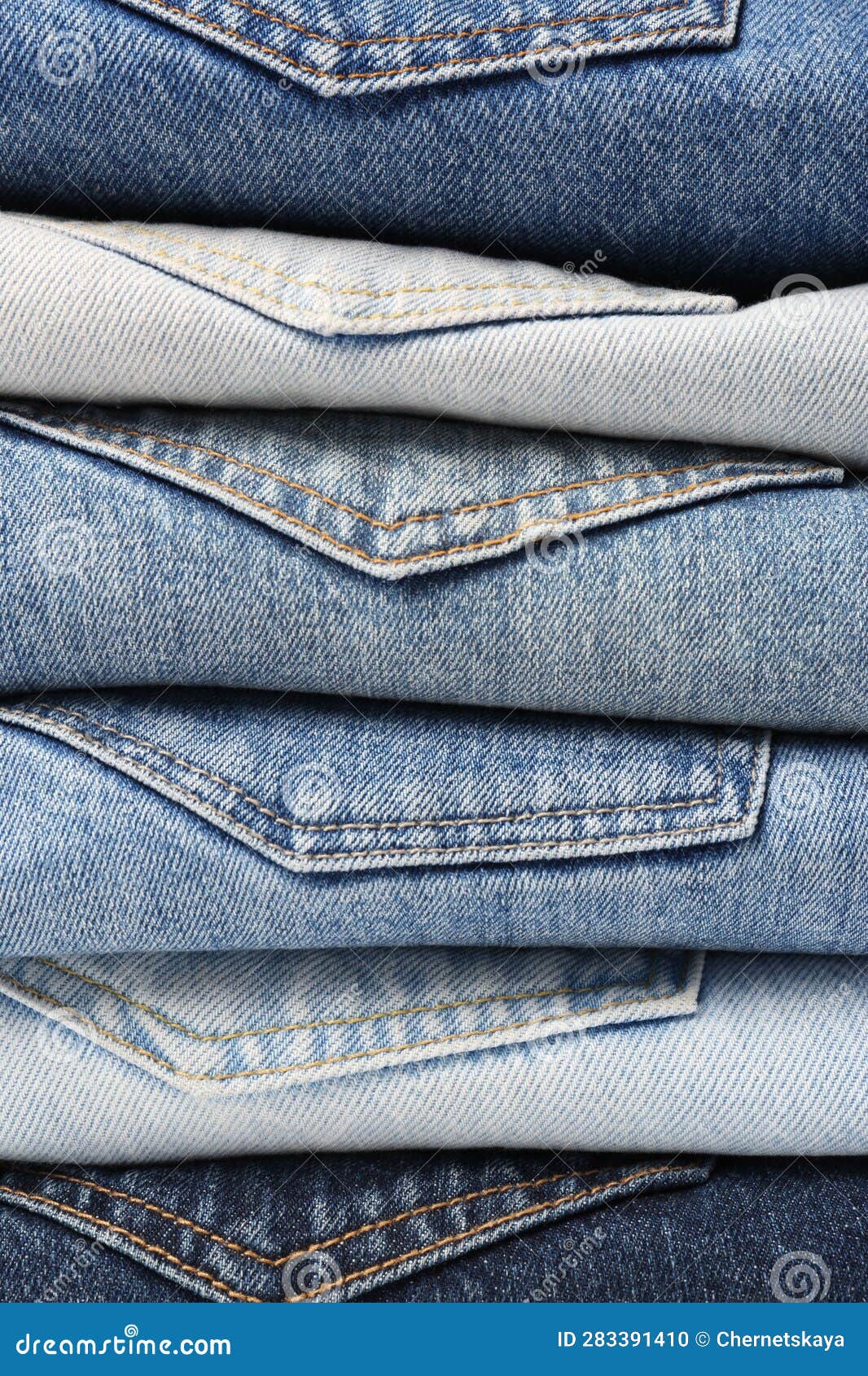 Stack of Different Folded Jeans As Background, Closeup Stock Photo ...