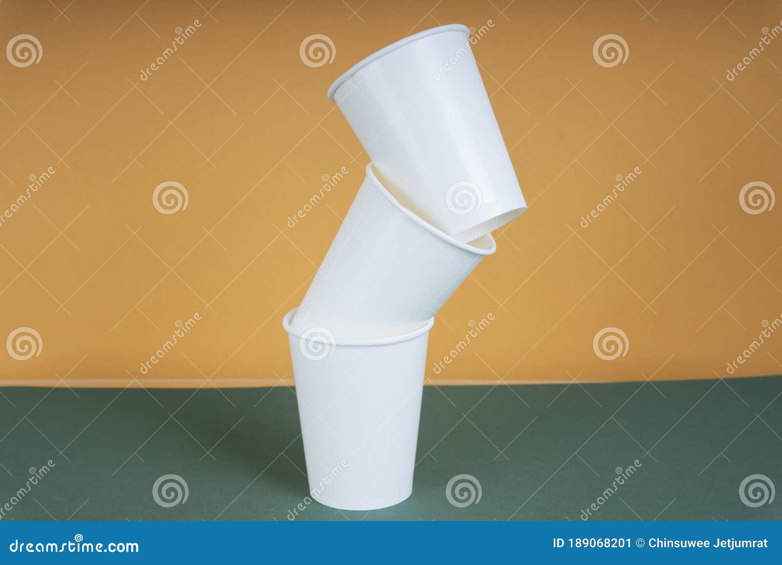 Stack of Disposable Plastic Paper Cup on Green Table Stock Image ...