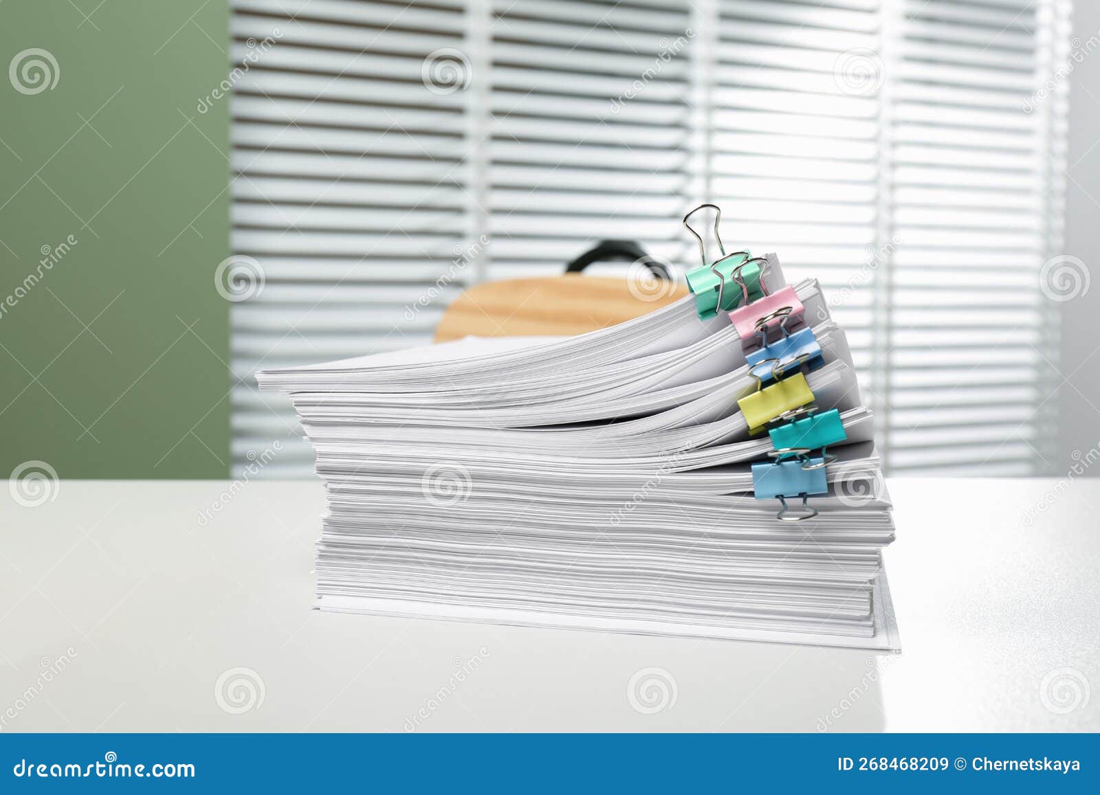 Stack of Documents Attached with Colorful Binder Clips on White Table ...
