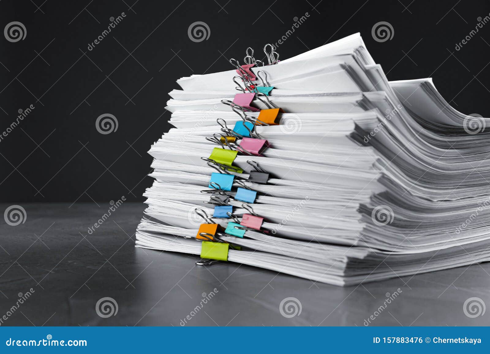 Stack of Documents with Binder Clips on Grey Stone Table Stock Photo ...