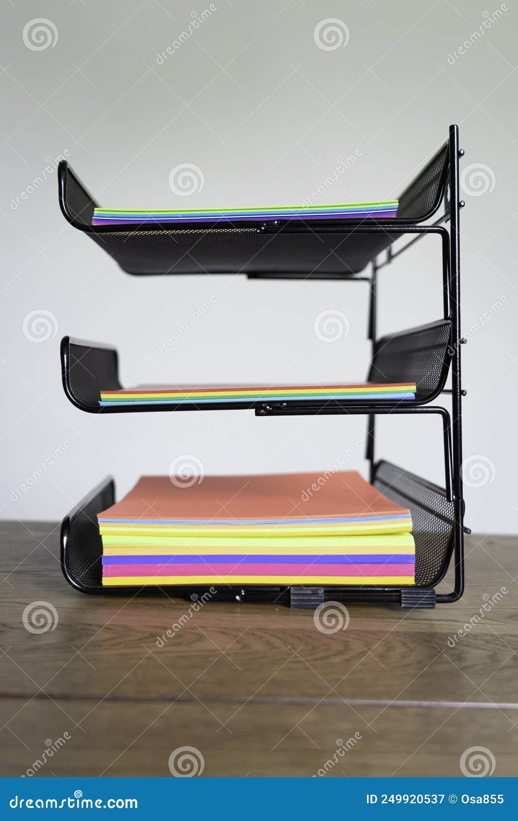 Stack of Documents on Brightly Colored Paper on Stacked Tray on Office ...