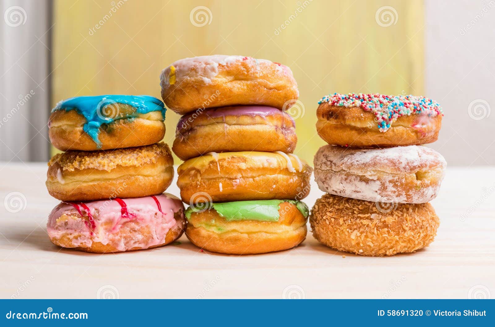 Stack of Donuts on Light Wooden Background Stock Photo - Image of ...