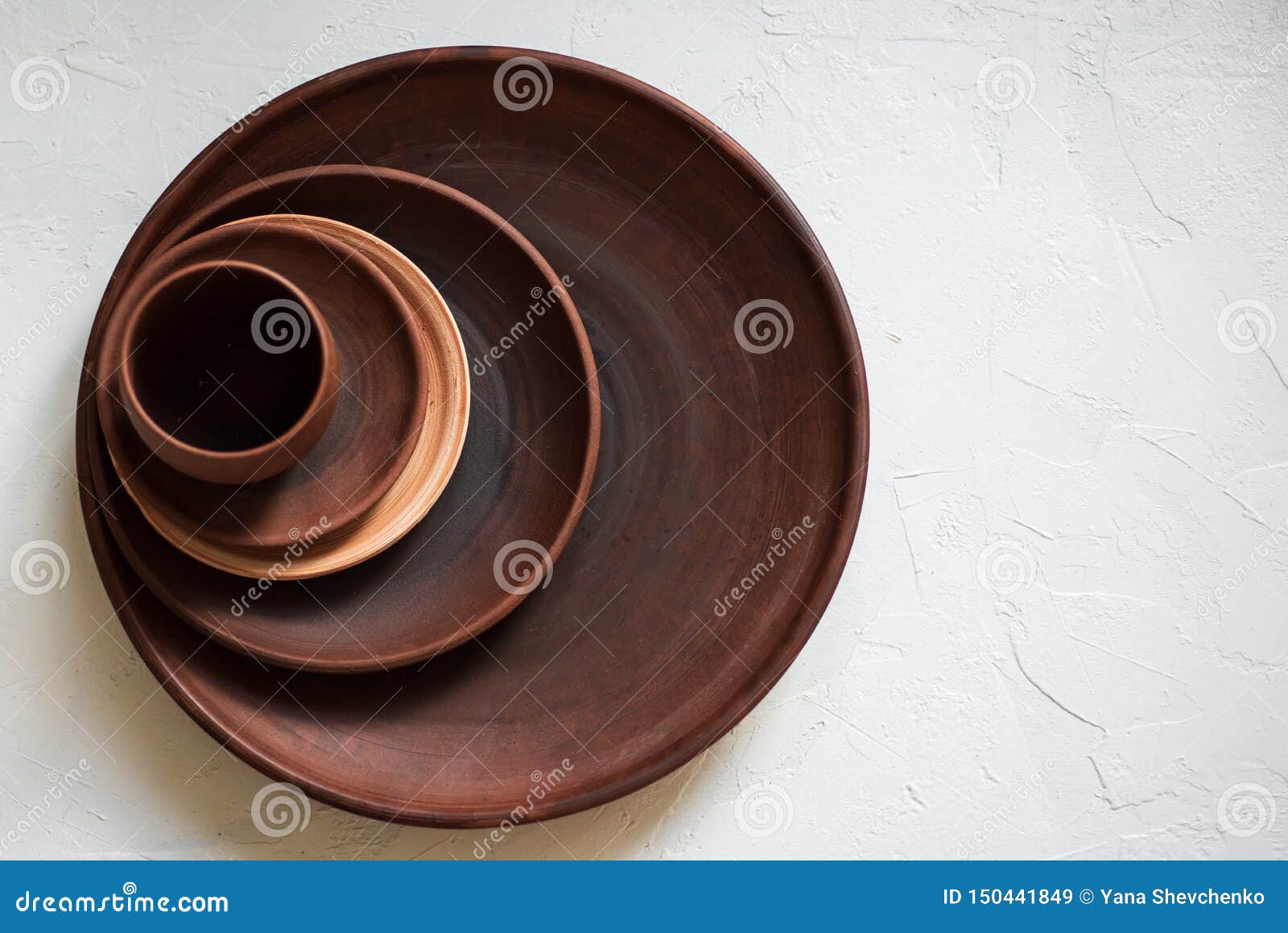 Stack of Earthenware Dishes on a White Background Stock Image - Image ...