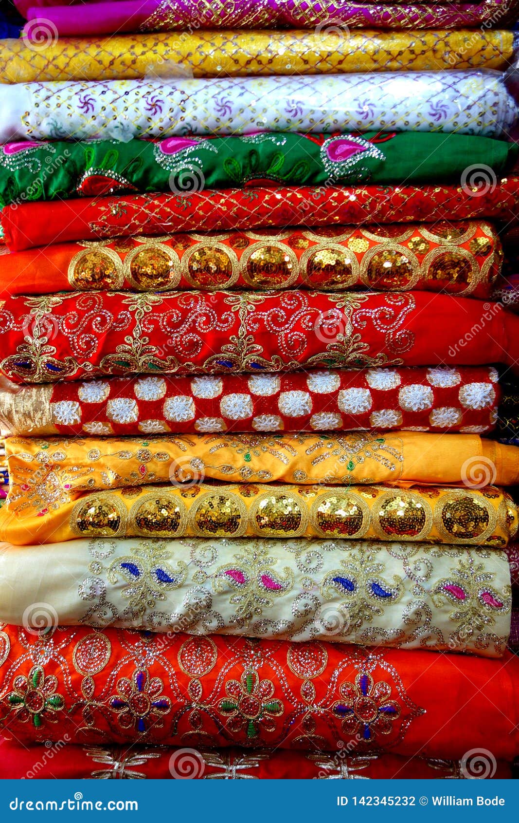 A Stack of Embroidered Patterned Fabrics Stock Photo - Image of ...