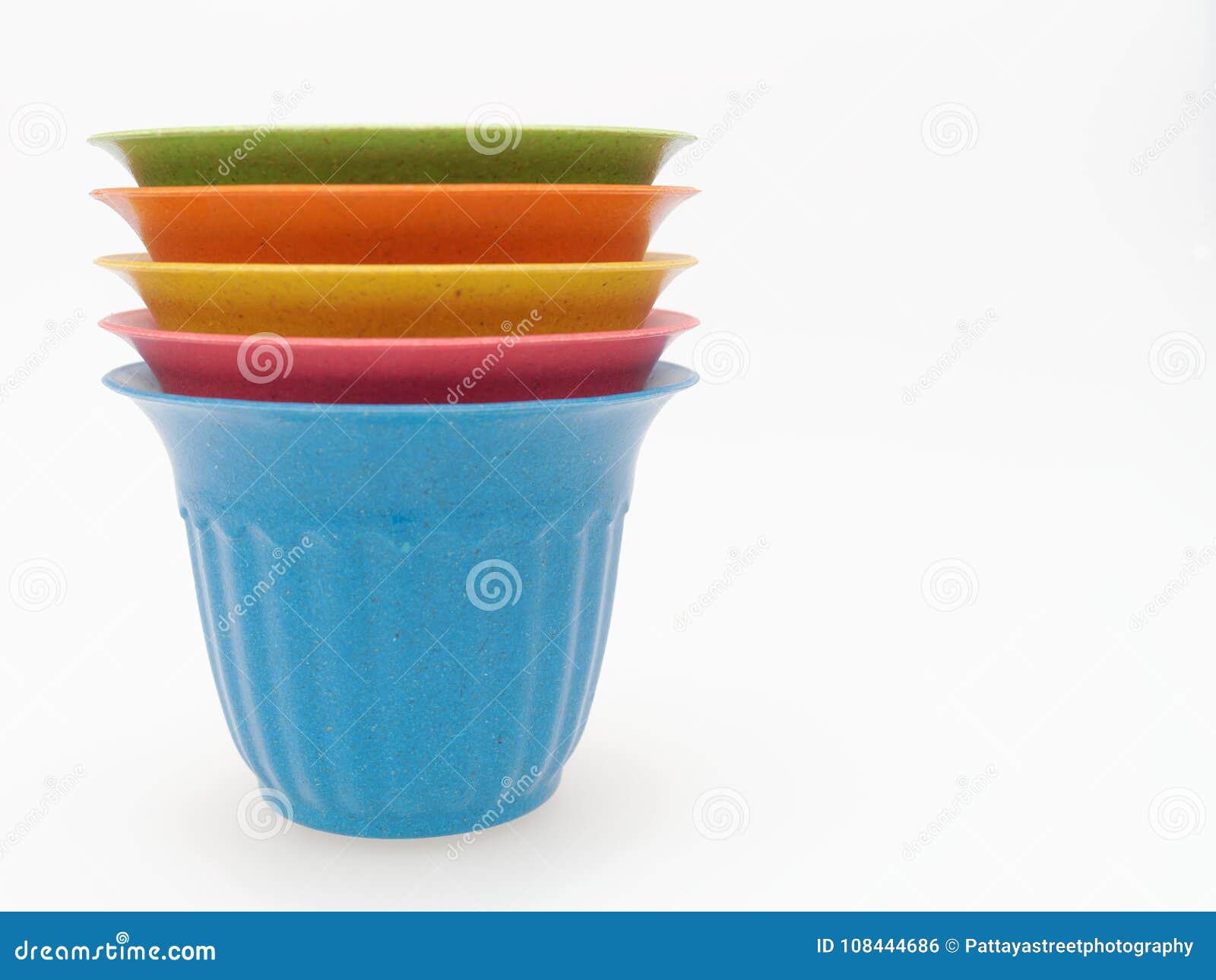 Stack of Empty Multi Color Plastic Plant Pot with Dotted and Stripped ...