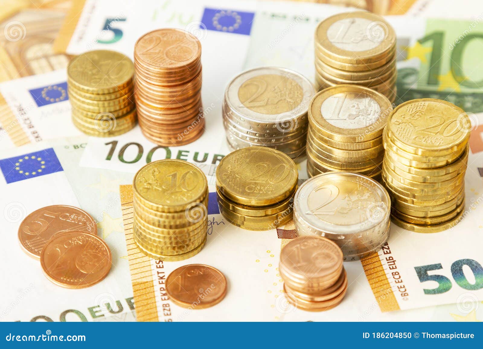 Stack of Euro Coins on Euro Banknotes, for Backgrounds Stock Photo ...