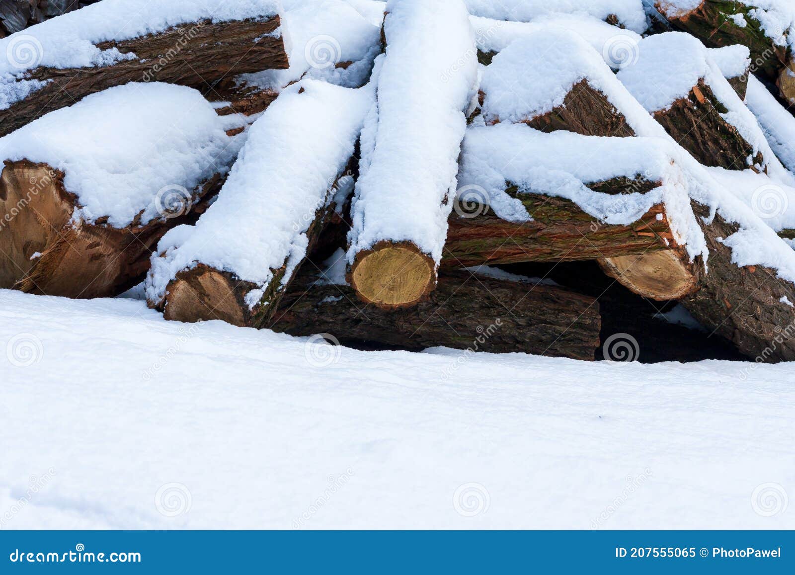 Stack of Firewood Covered with Snow Outdoors. Stack of Wood Cut. Snow ...