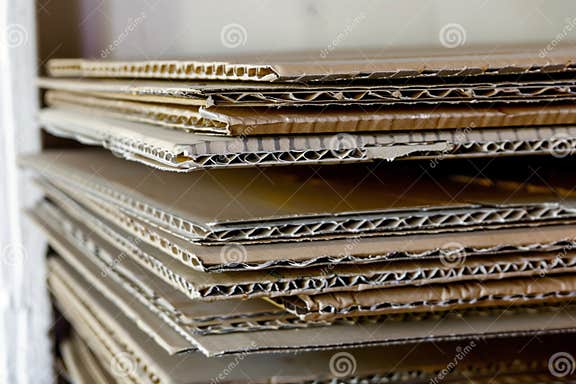 Stack of Flat Cardboard Boxes in Corner Stock Image - Image of ...