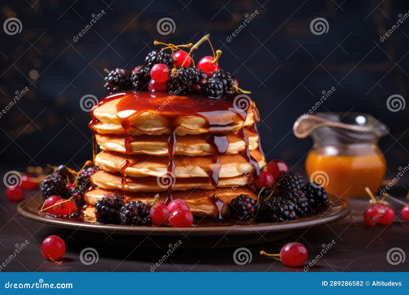 Stack of Fluffy Pancakes with Syrup and Berries on Top Stock Photo ...
