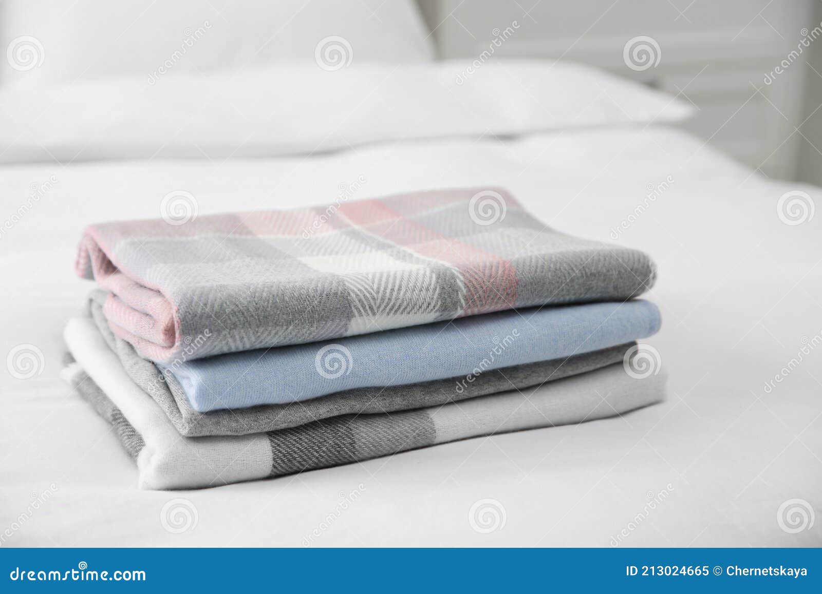 Stack of Folded Cashmere Clothes on Bed Stock Image - Image of material ...