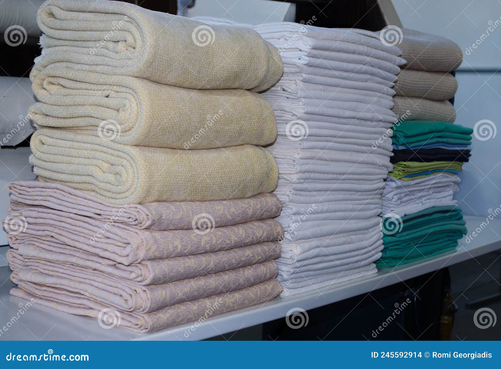 Stack of Folded Clean Sheets and Surgical Clothes in an Industrial ...