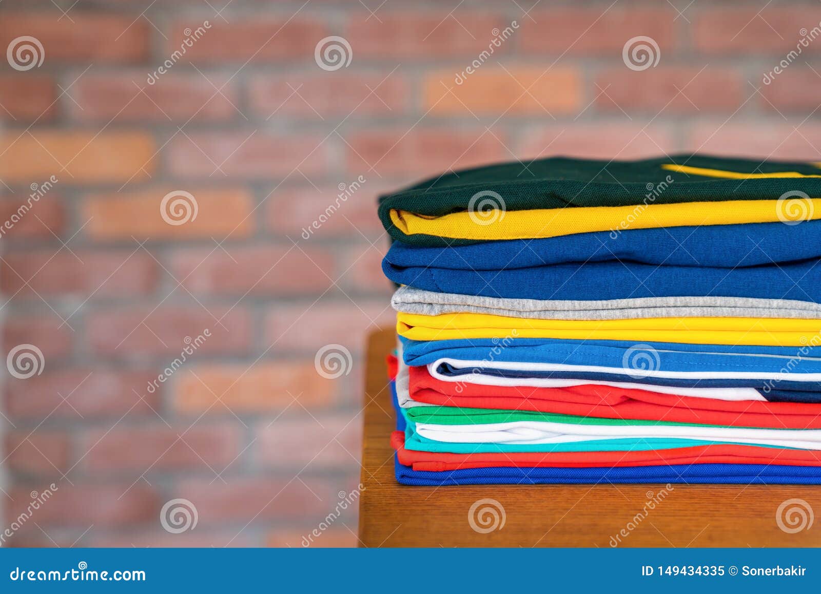 Stack of Folded Clothes on Table Indoor.Fresh Folded Cotton Clothing ...