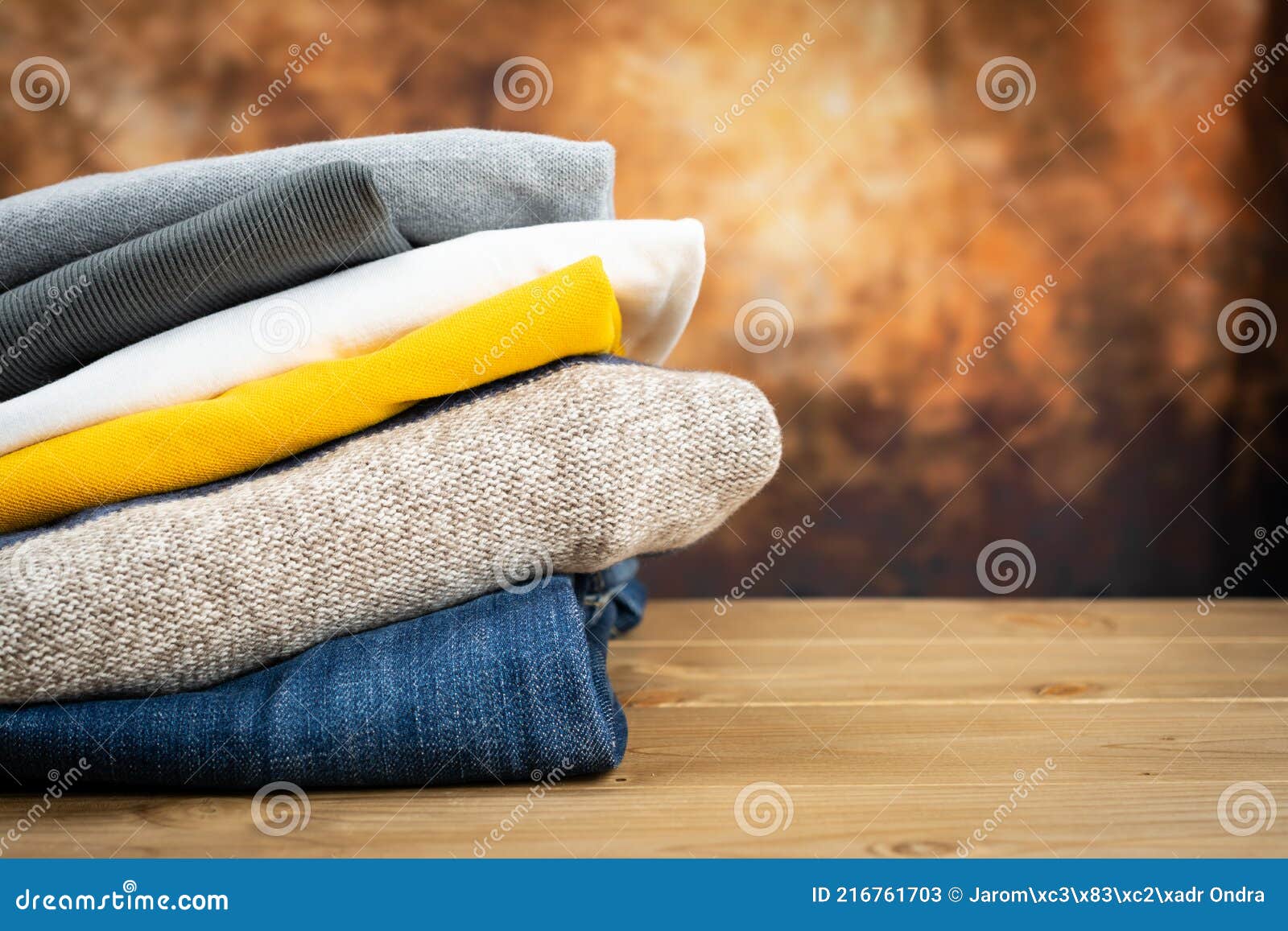 Stack of folded clothes stock image. Image of people - 216761703