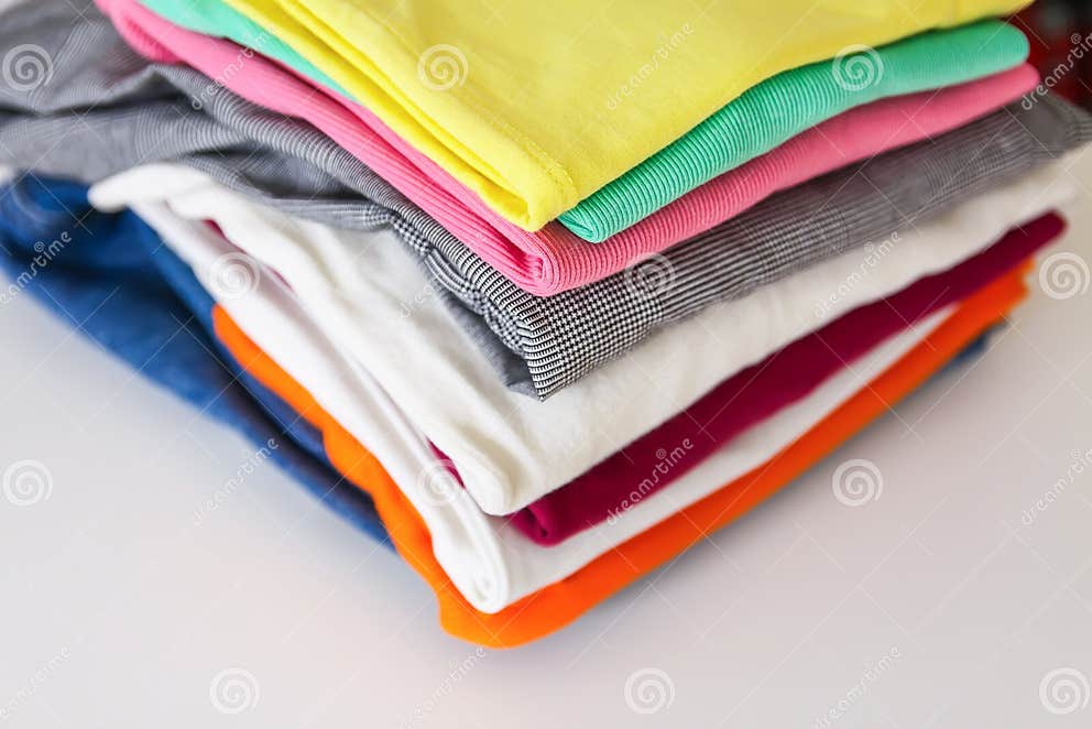 Stack of Folded Colorful Clothes. Compact Storage Organizing Stock ...