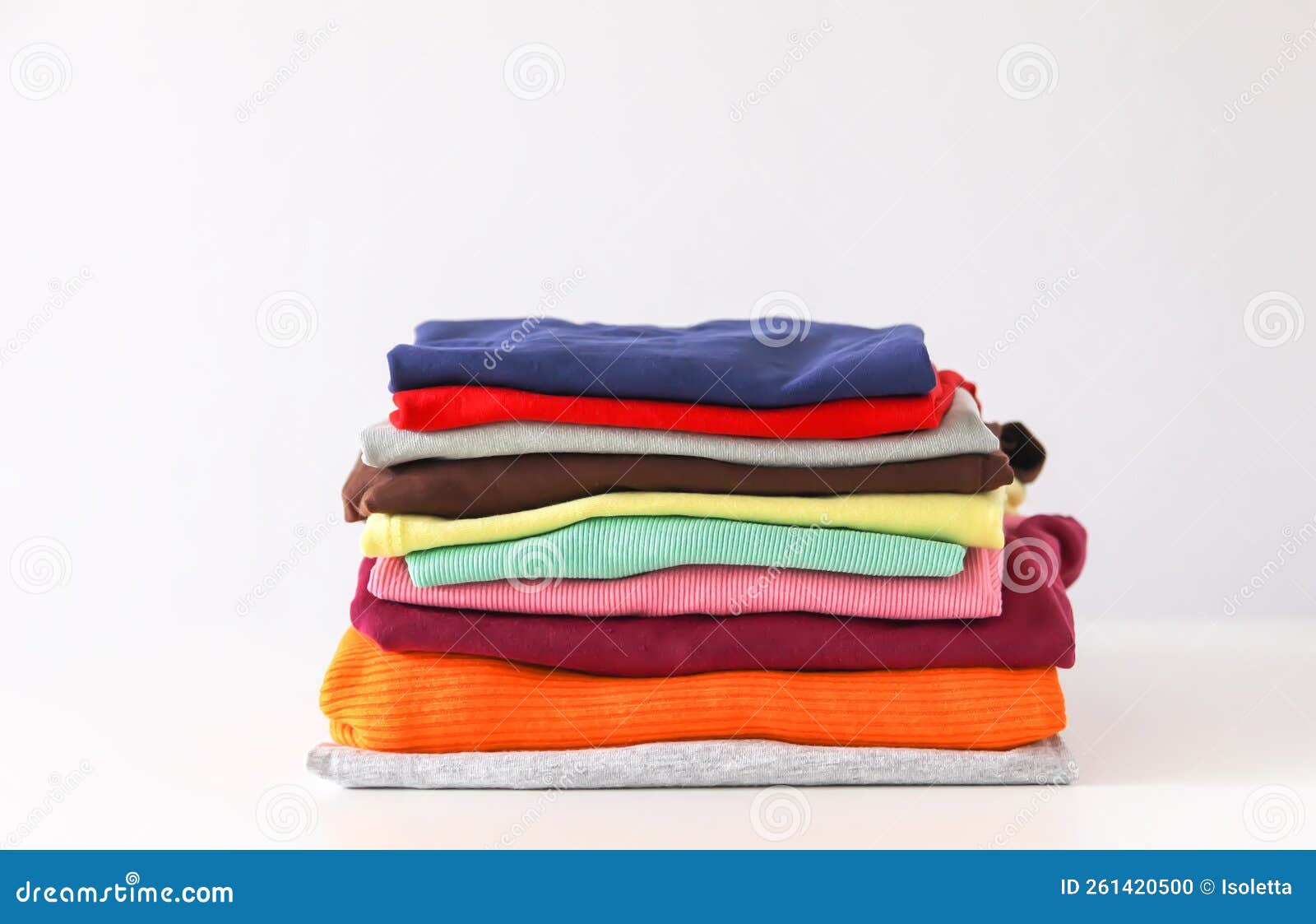Stack of Folded Colorful Clothes. Compact Storage Organizing Stock ...