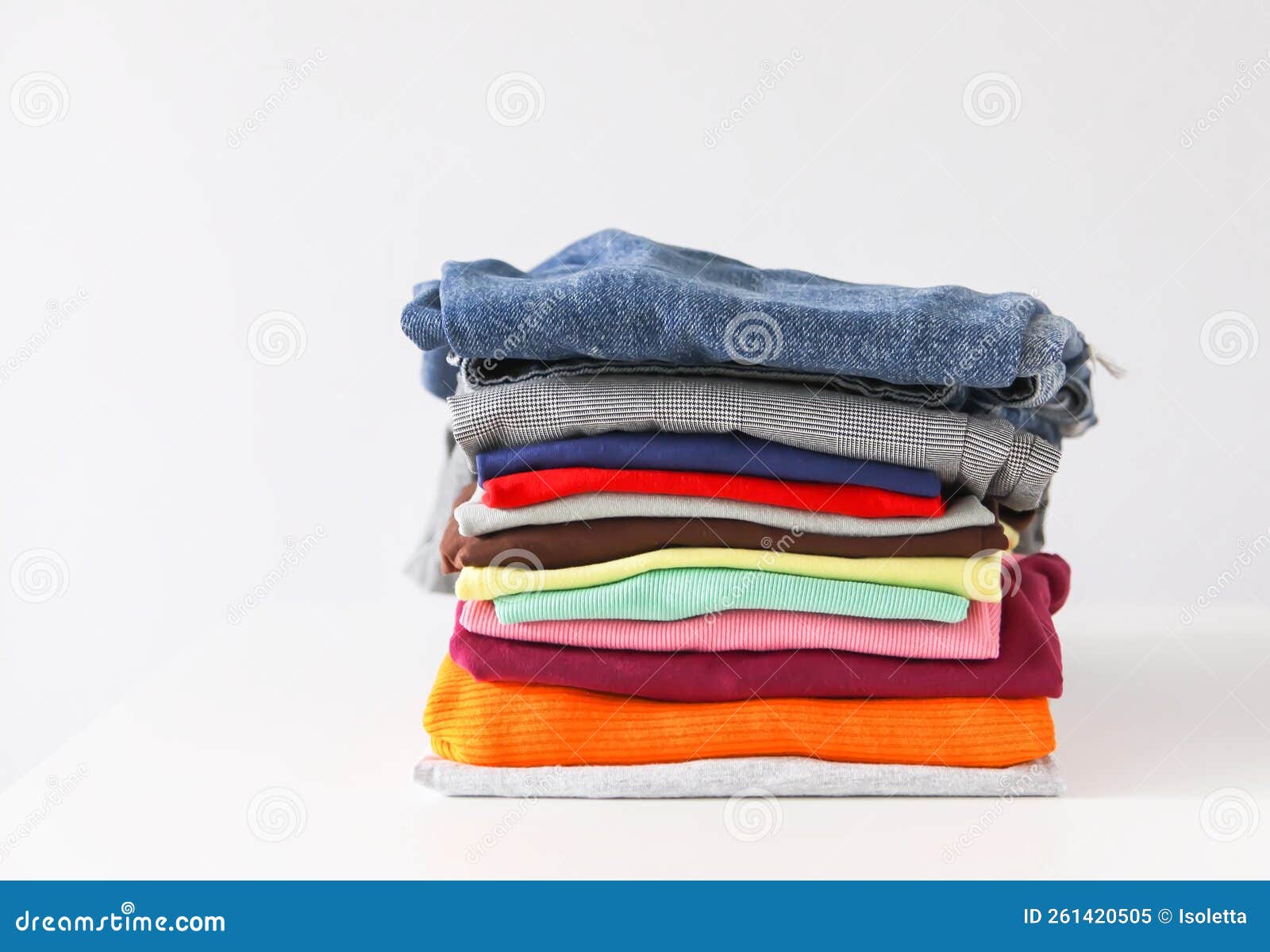 Stack of Folded Colorful Clothes. Compact Storage Organizing Stock ...