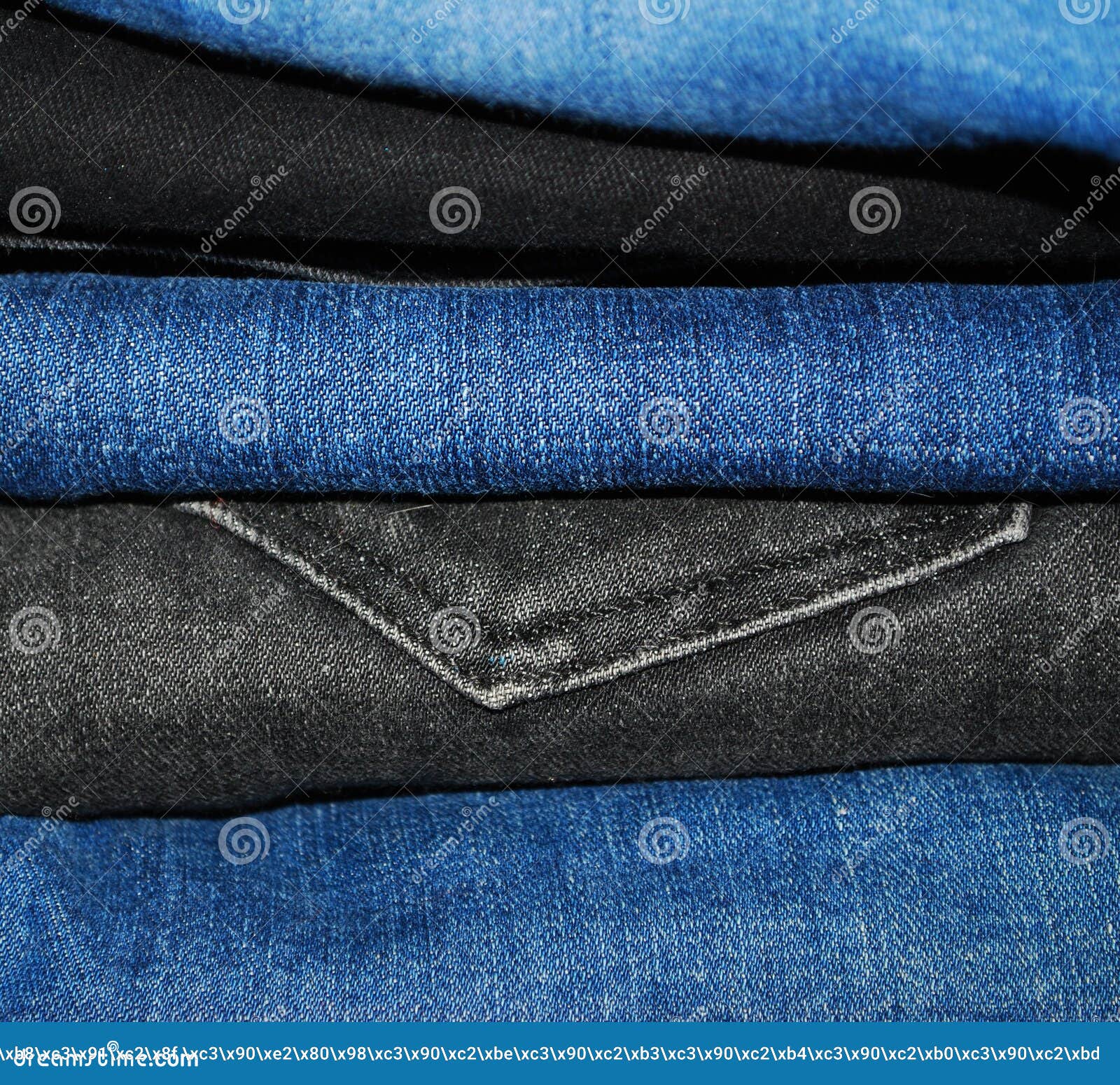 A Stack of Folded Denim Pants Close-up Stock Photo - Image of folded ...