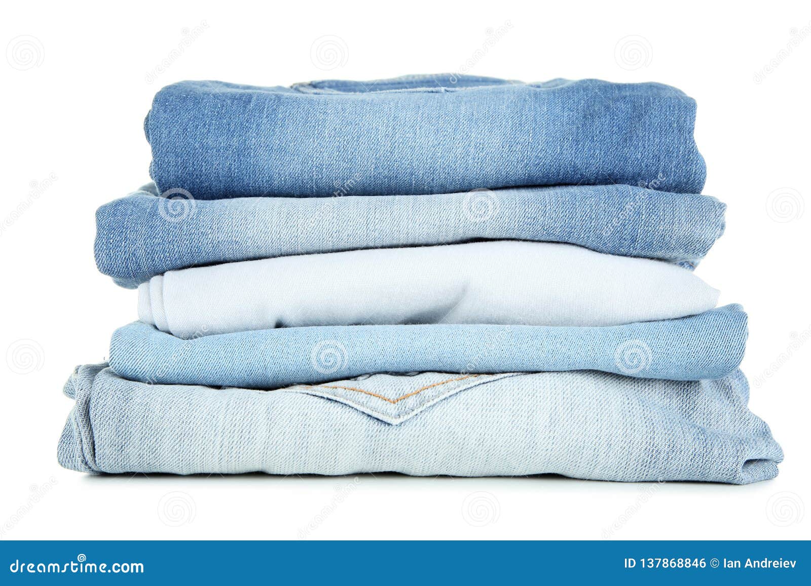Stack of folded jeans stock photo. Image of store, isolated - 137868846