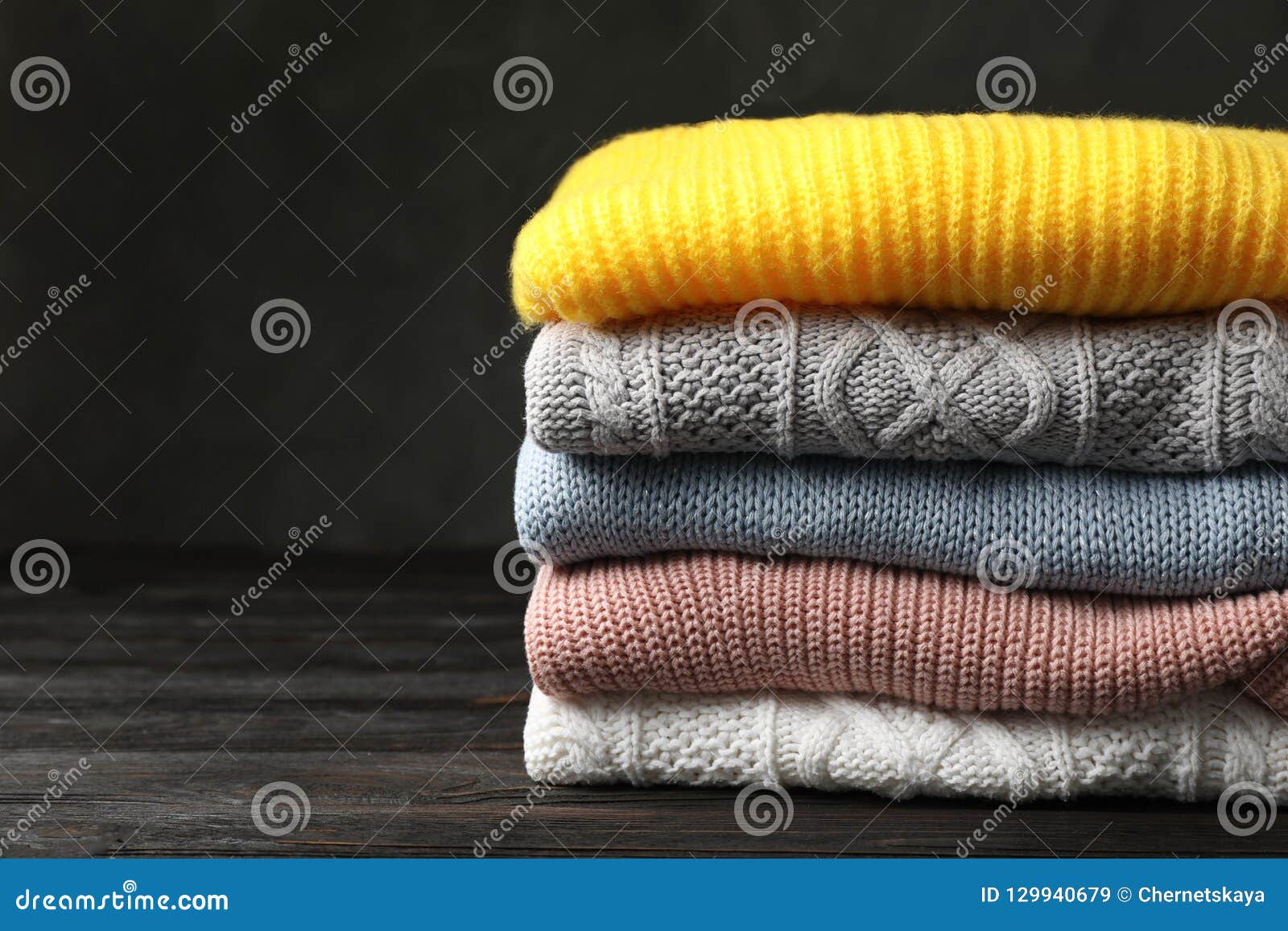 Stack of Folded Knitted Sweaters on Table Stock Image - Image of retail ...