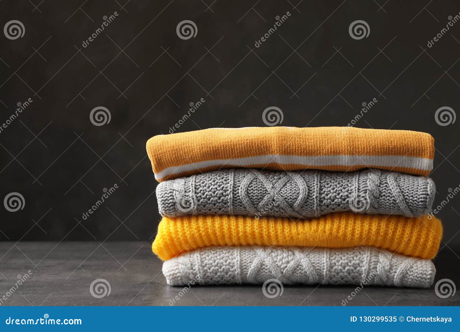 Stack of Folded Knitted Sweaters on Table Stock Image - Image of cloth ...