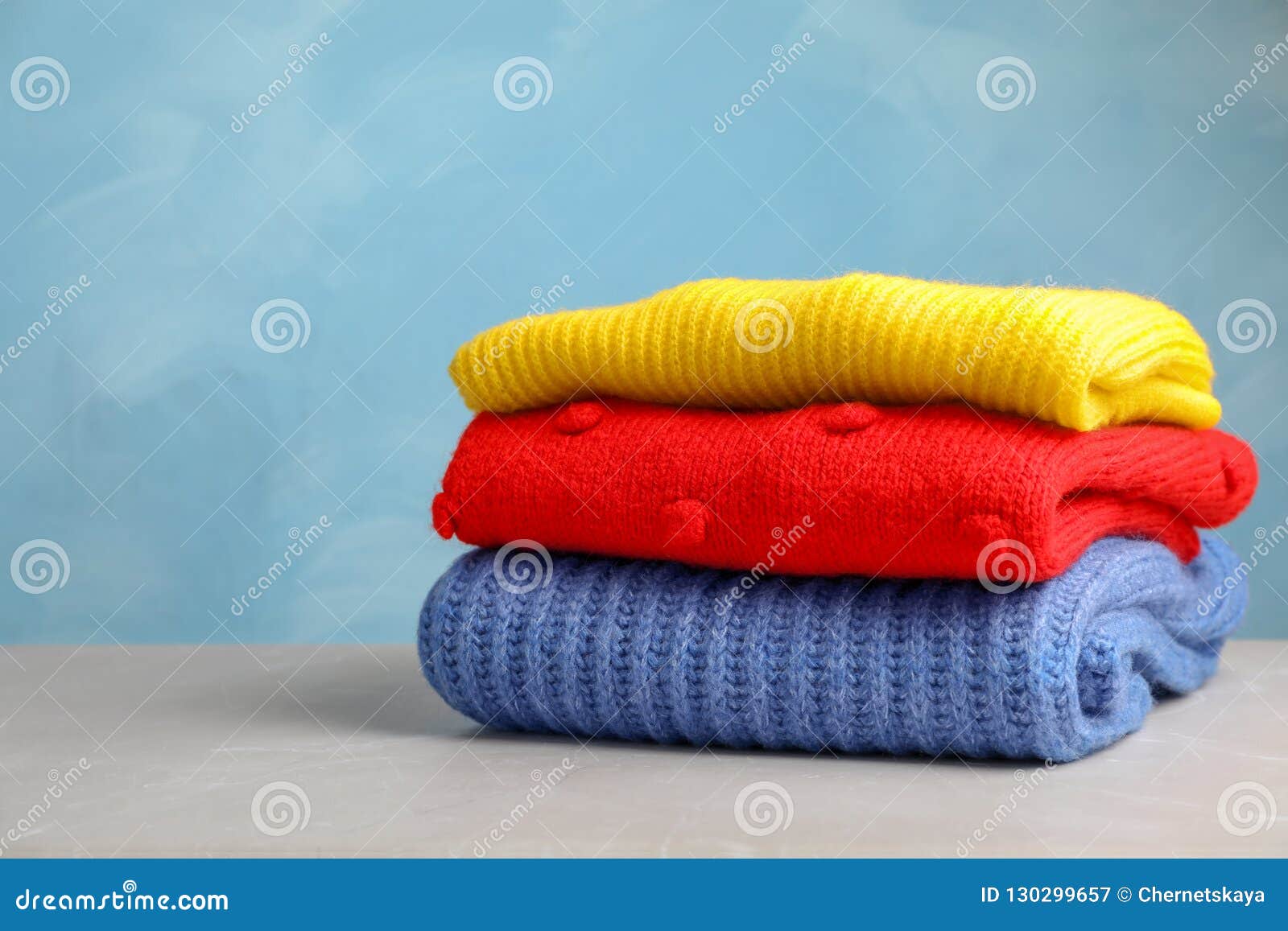 Stack of Folded Knitted Sweaters on Table Stock Image - Image of ...