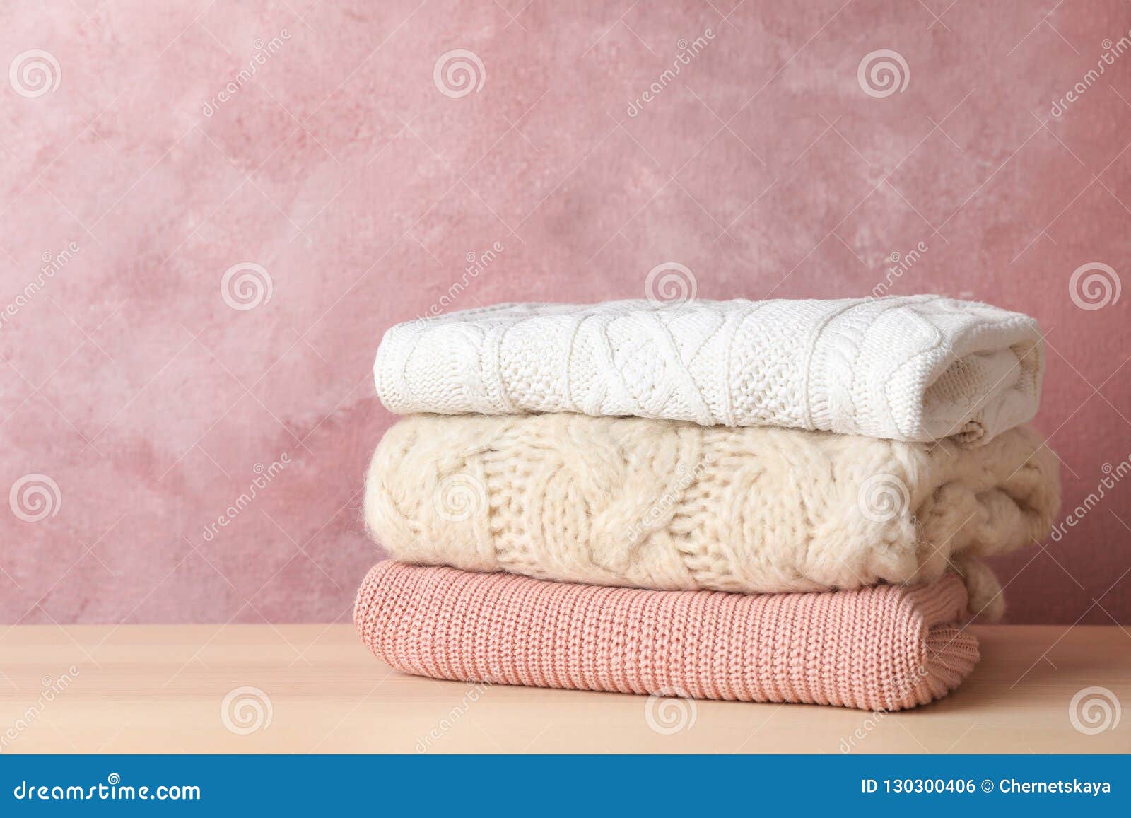 Stack of Folded Knitted Sweaters on Table. Stock Photo - Image of copy ...