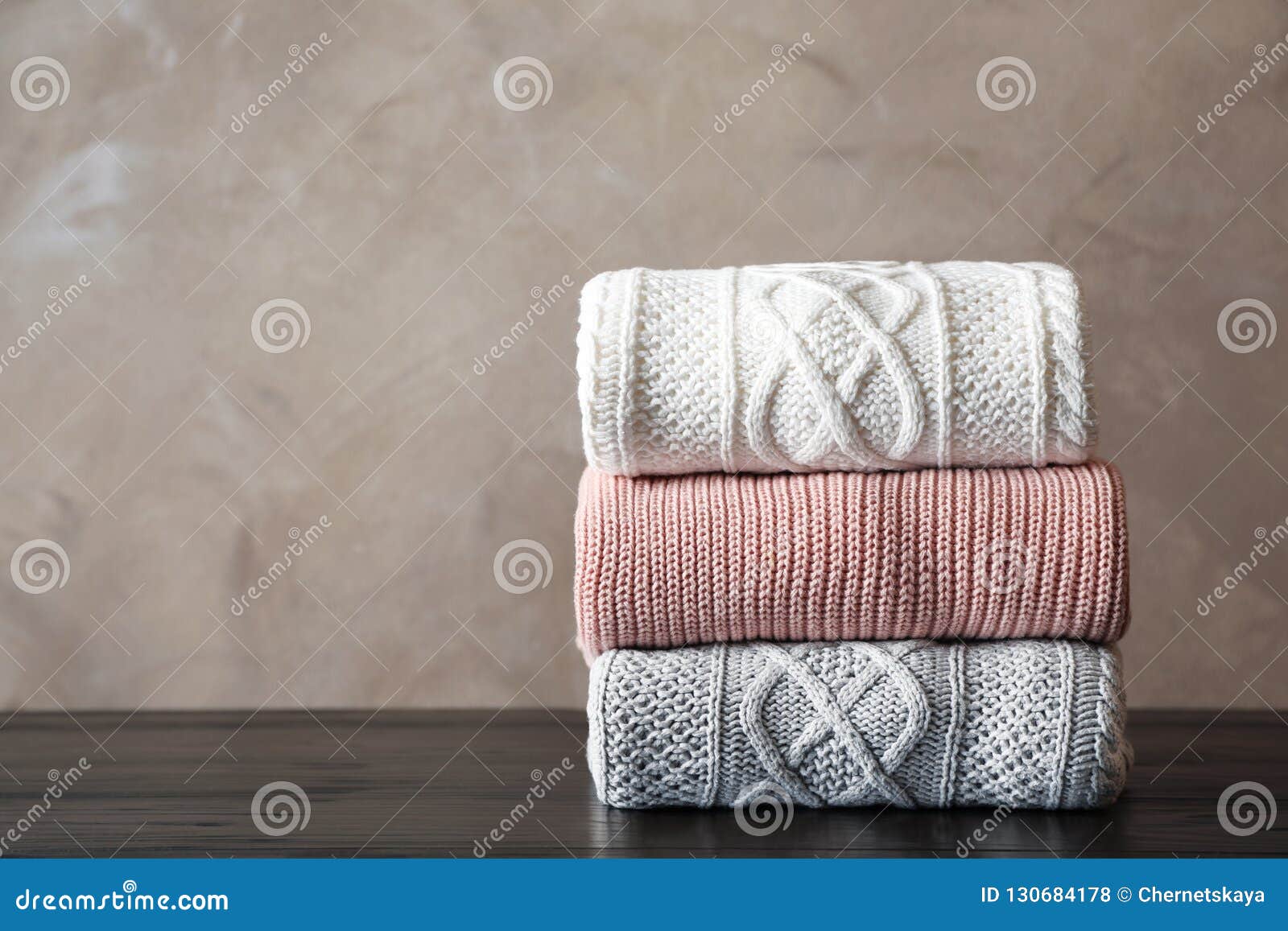 Stack of Folded Knitted Sweaters on Table Stock Photo - Image of season ...