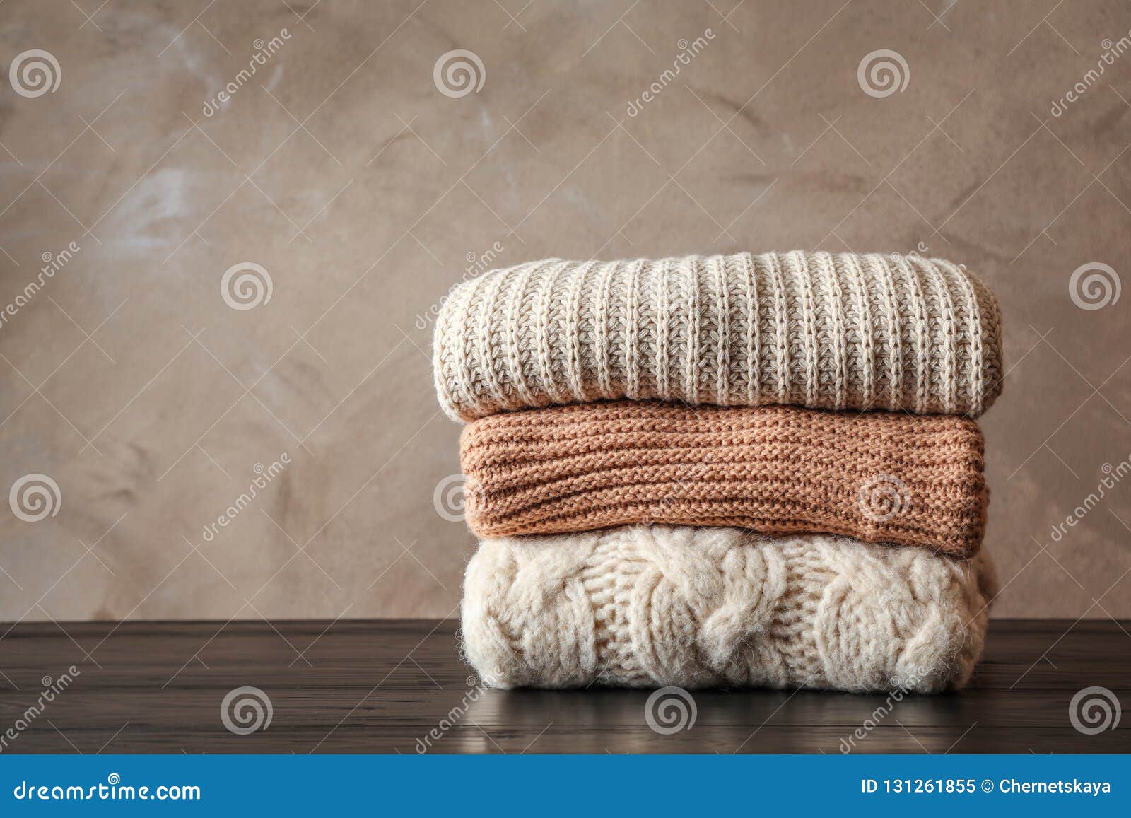 Stack of Folded Knitted Sweaters on Table Stock Image - Image of ...